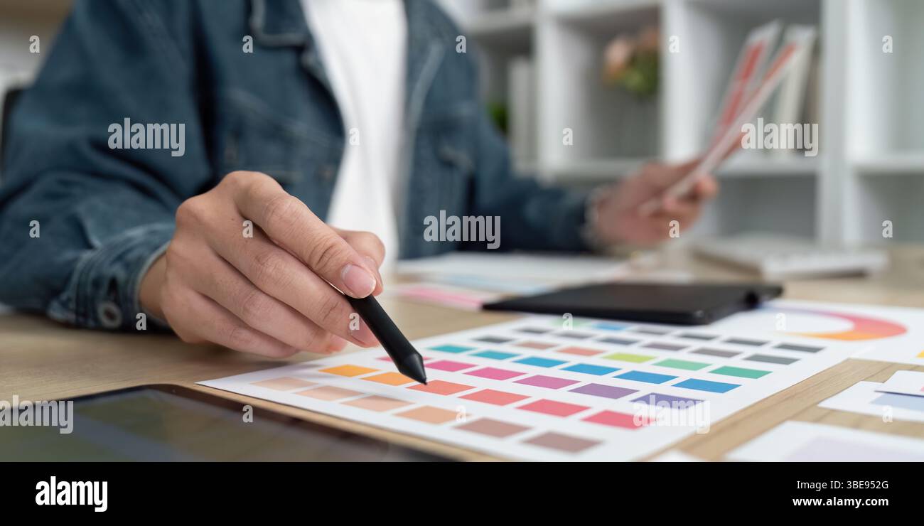Design Focus: Artist Analyzing Color Schemes and Layouts Stock Photo ...