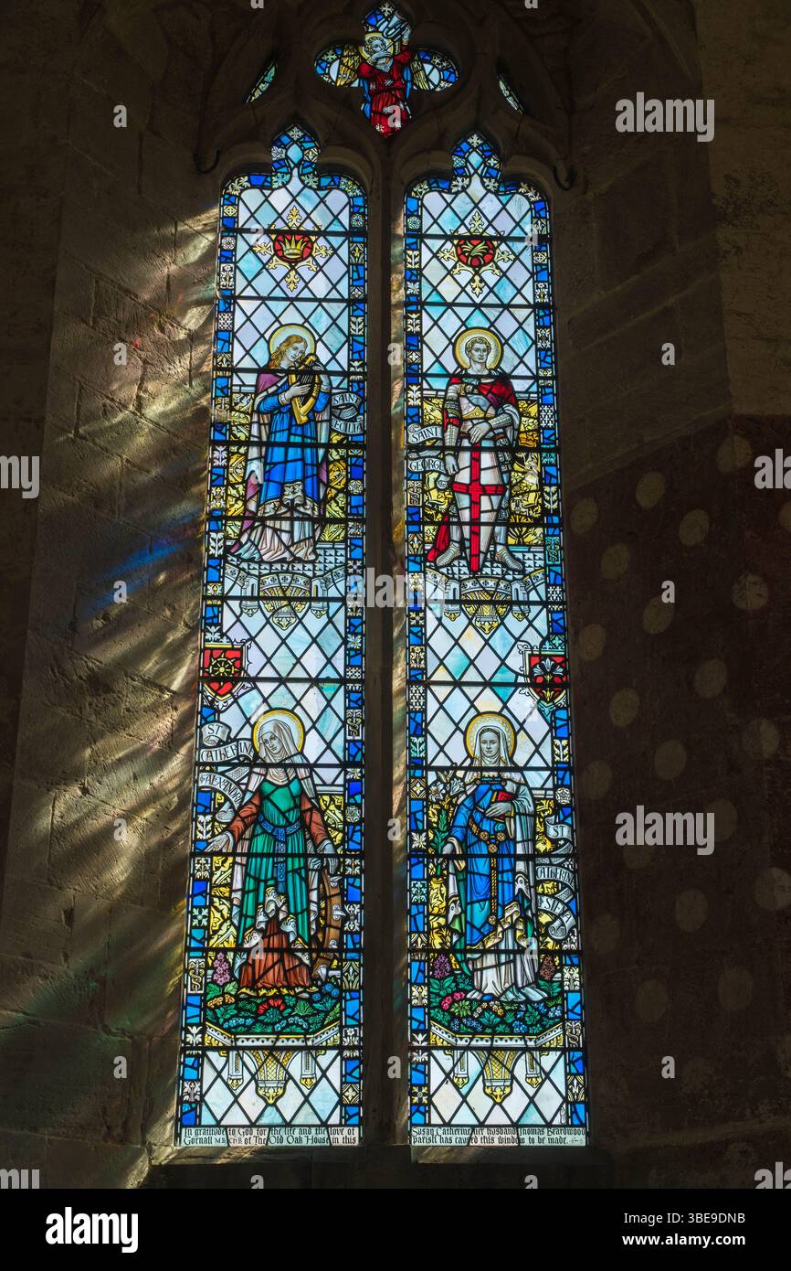 Stained glass depicting saints Cecilia, George, Catherine of Alxandria and Catherine of Siena ...