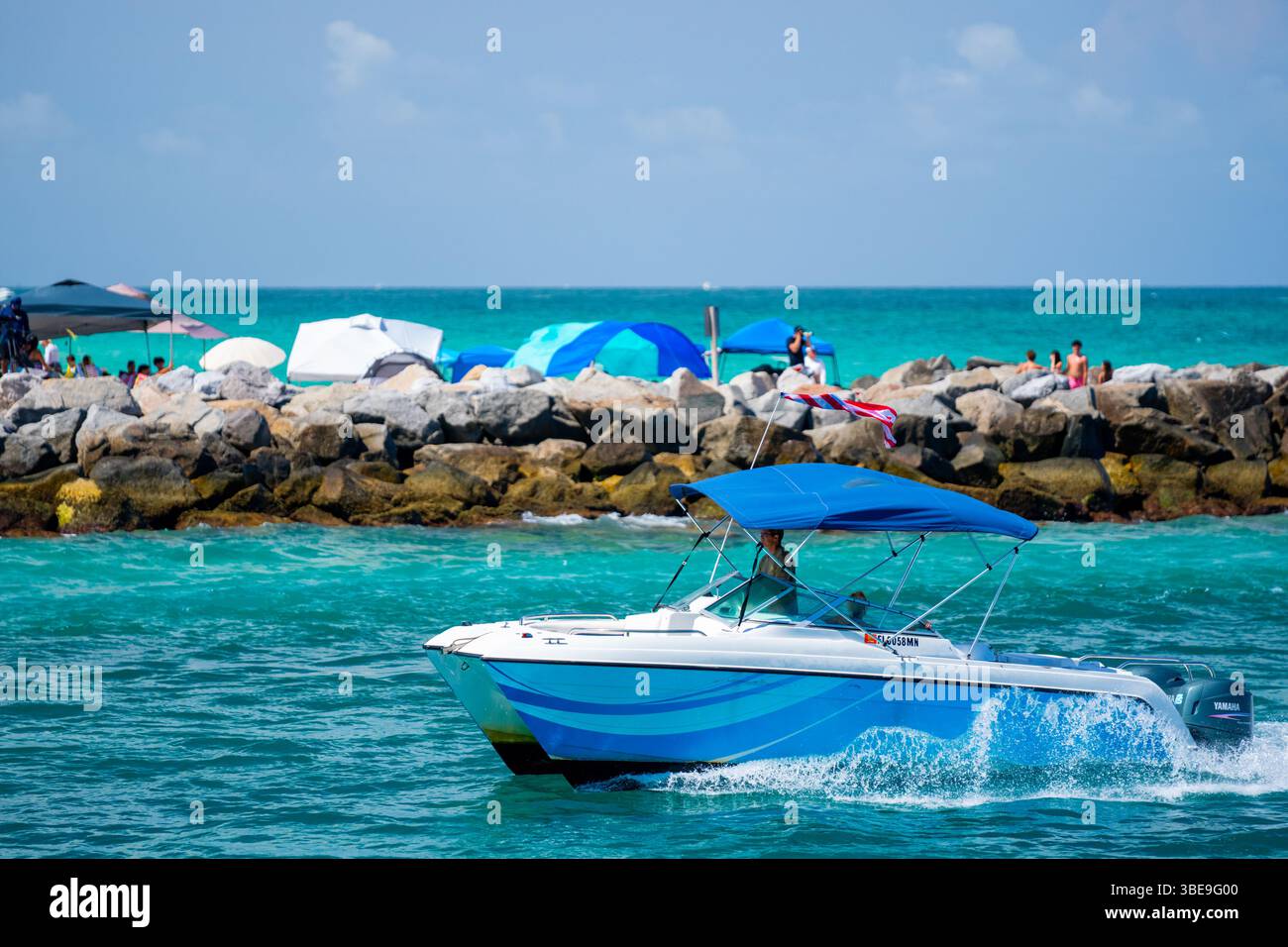 Miami Beach, FL, USA - May 25, 2025: Small catamaran in Miami Beach ...