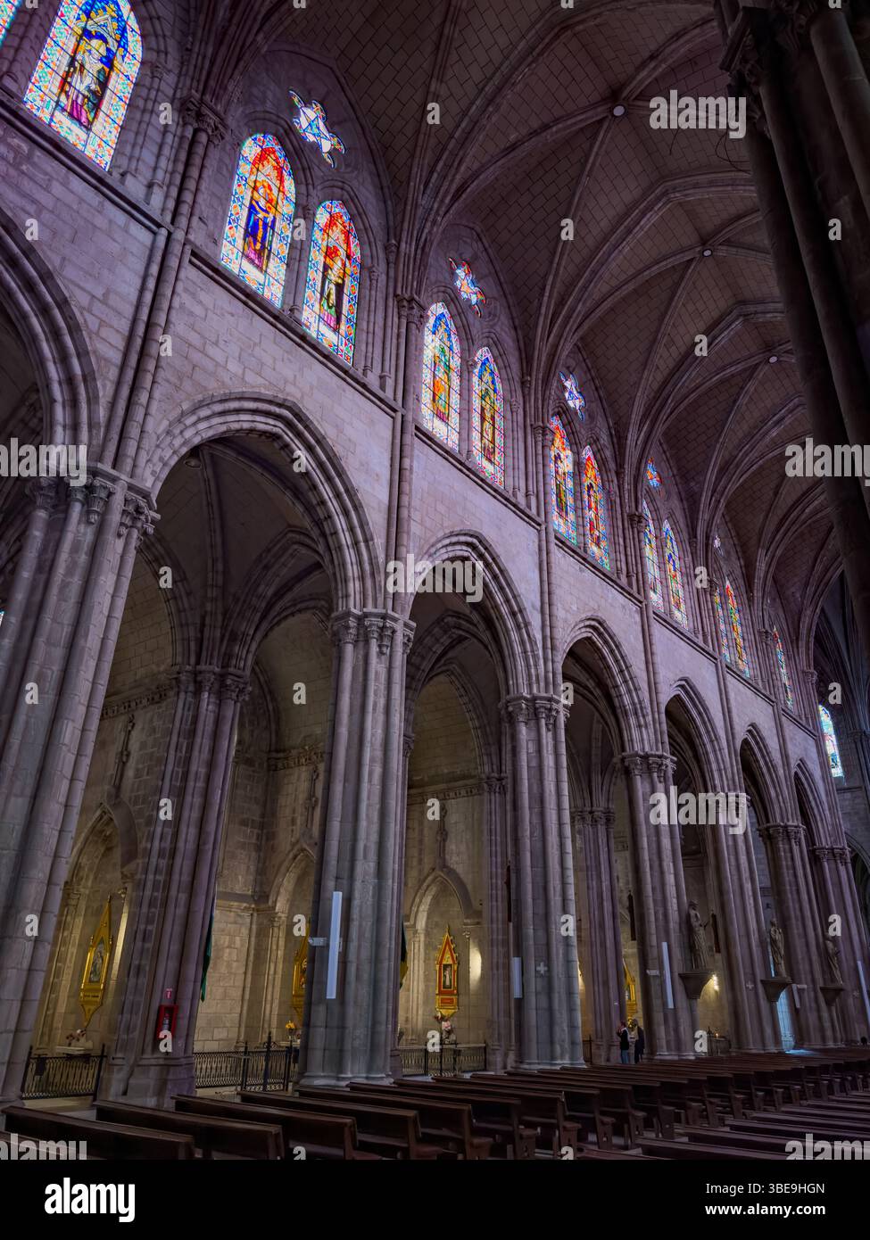 Stained glass windows in the nave of the Basilica del Voto Nacional in ...