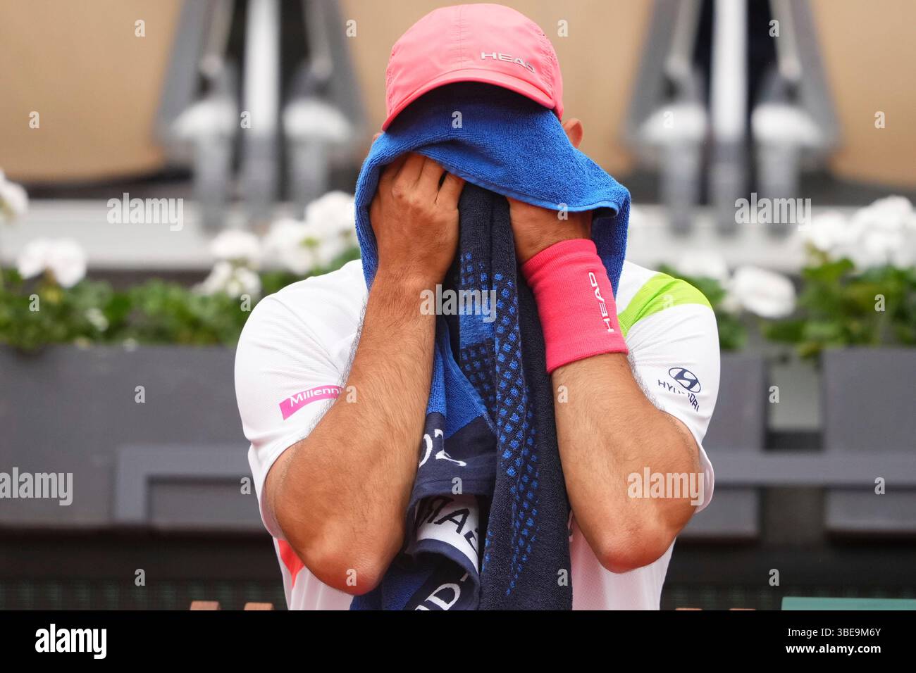 Portugal's Nuno Borges wipes his face as he plays Norway's Casper Ruud during their second round ...