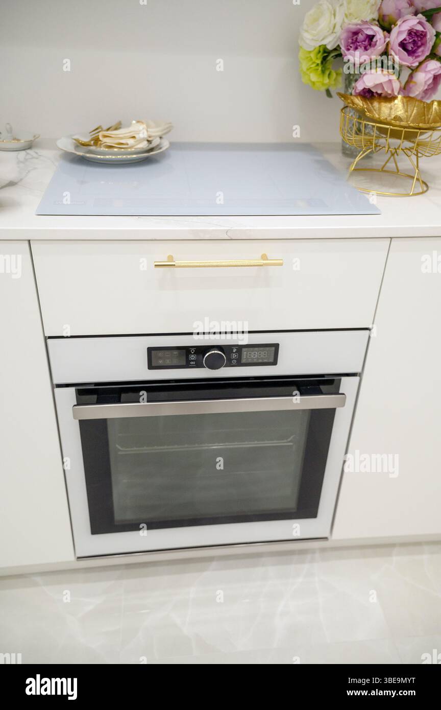 A stove top oven sitting inside of a kitchen Stock Photo - Alamy