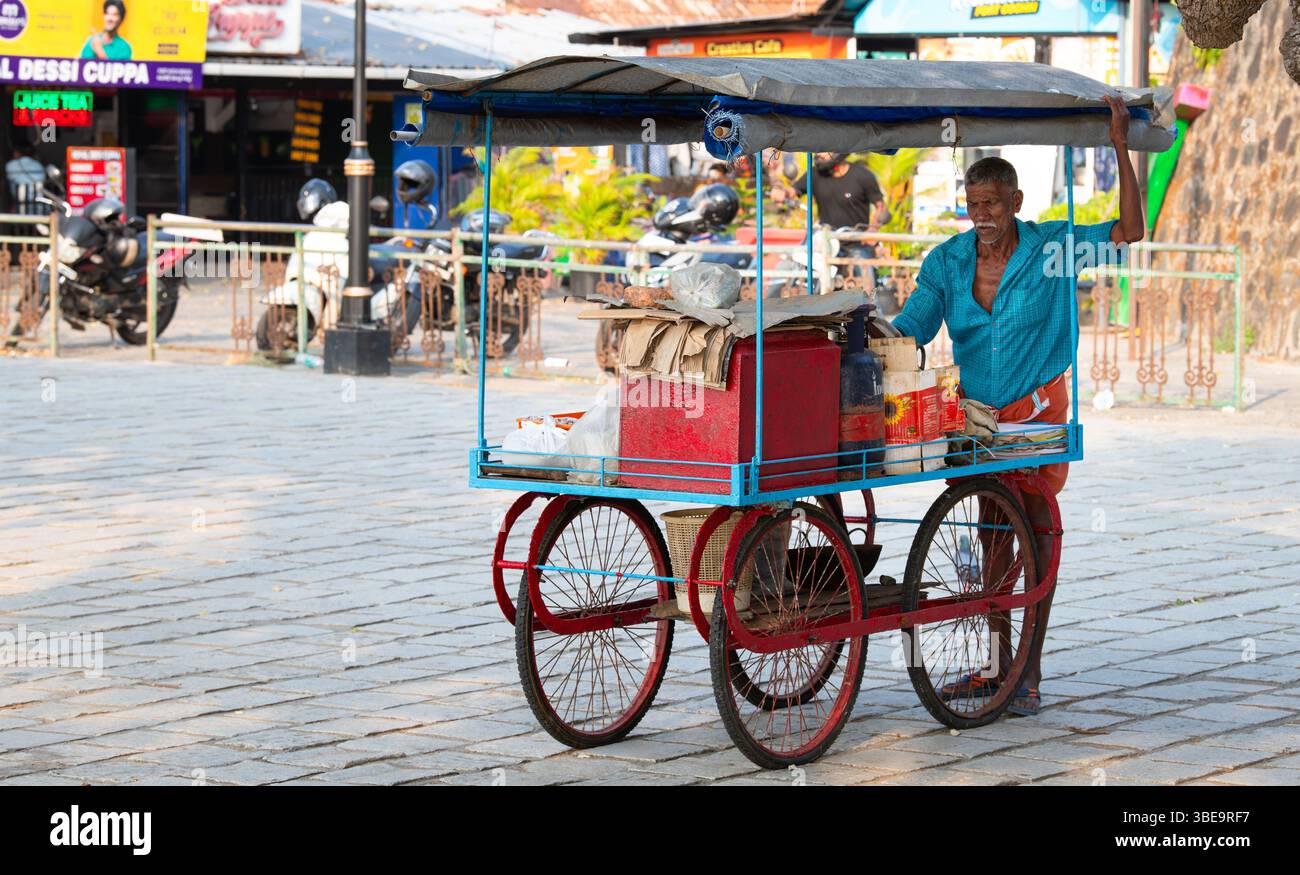 Sale of food and drinksat market stall hand cart on street in India ...