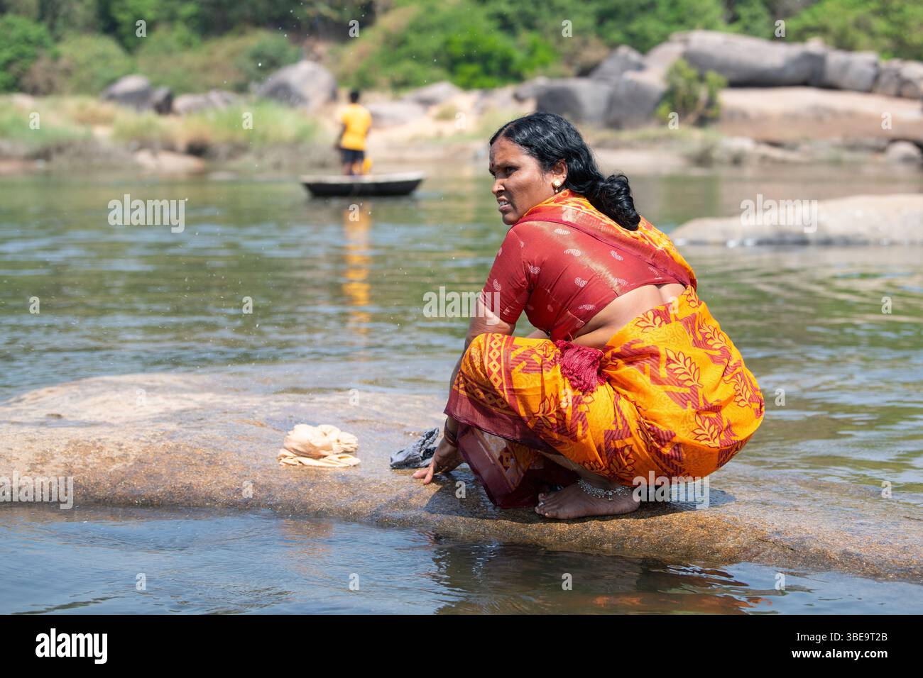 Indian woman washing clothes hi-res stock photography and images - Alamy