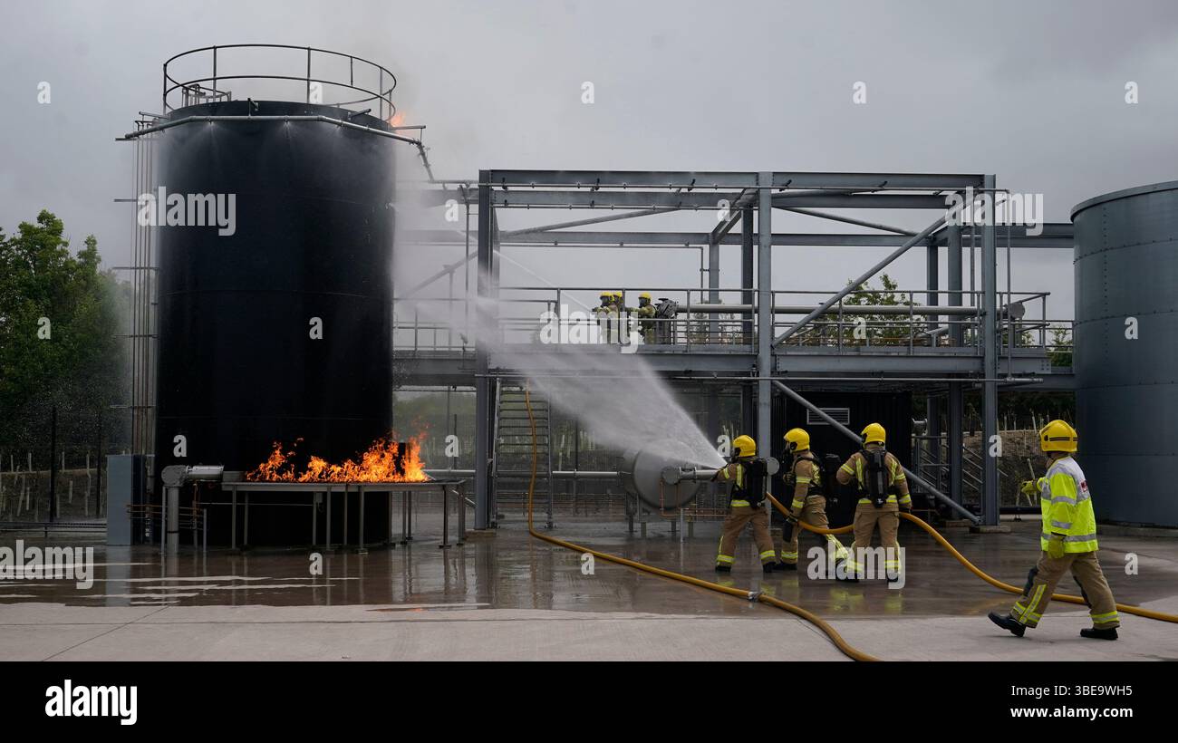Firefighters tackle a gas valve leak at the opening of the new Learning ...