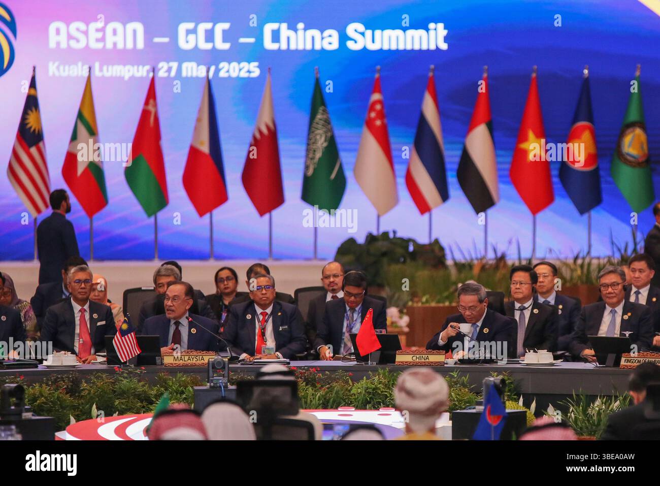 China's Premier Li Qiang (right) drinks tea during Malaysia's Prime Minister Anwar Ibrahim makes ...