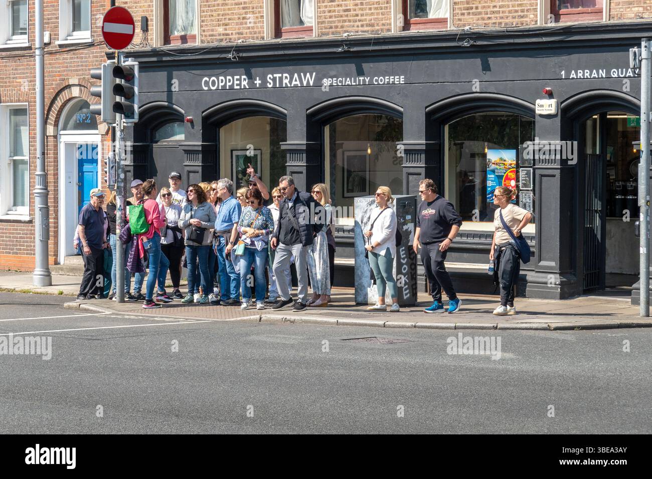 Group Of Tourists On A Guided Walking Tour Of Dublin Ireland Wait For A ...