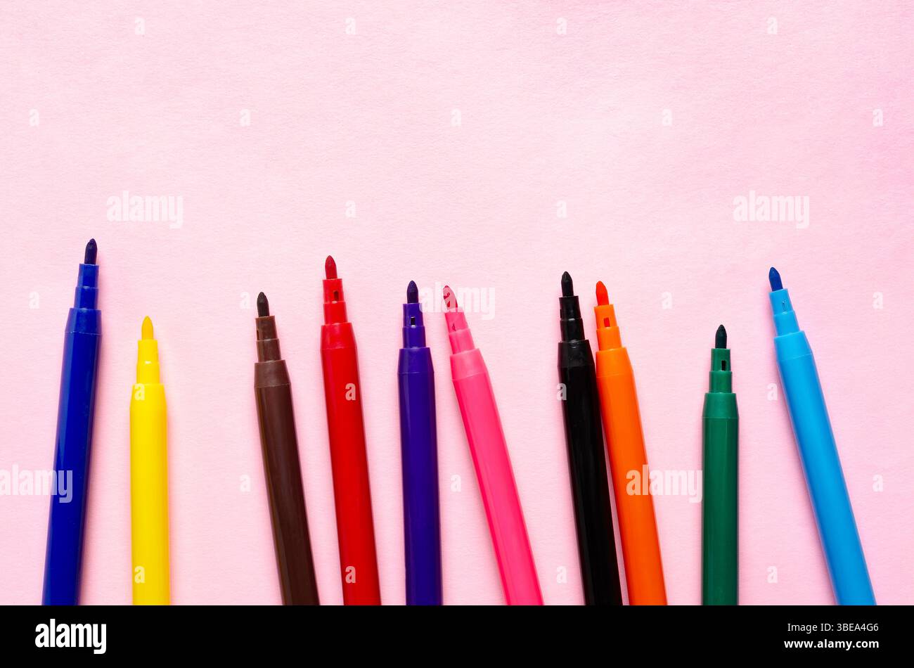 Colorful markers arranged on a pink background with copy space Stock ...
