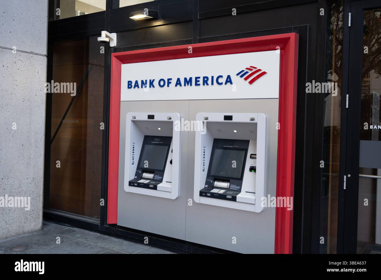 Facade of Bank of America with two automated teller machines (ATMs) on a city sidewalk, San ...