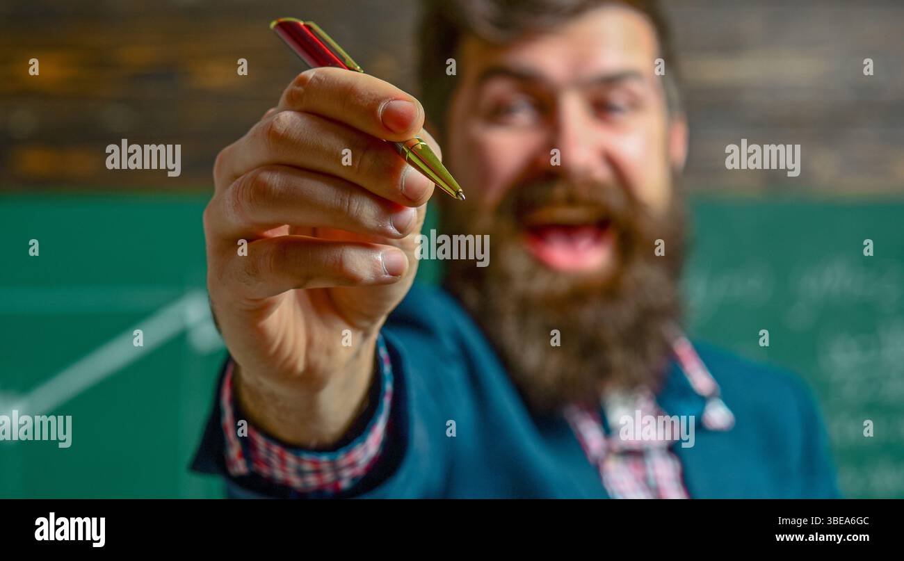 Teacher explains math in class. Professor in classroom on math lesson ...