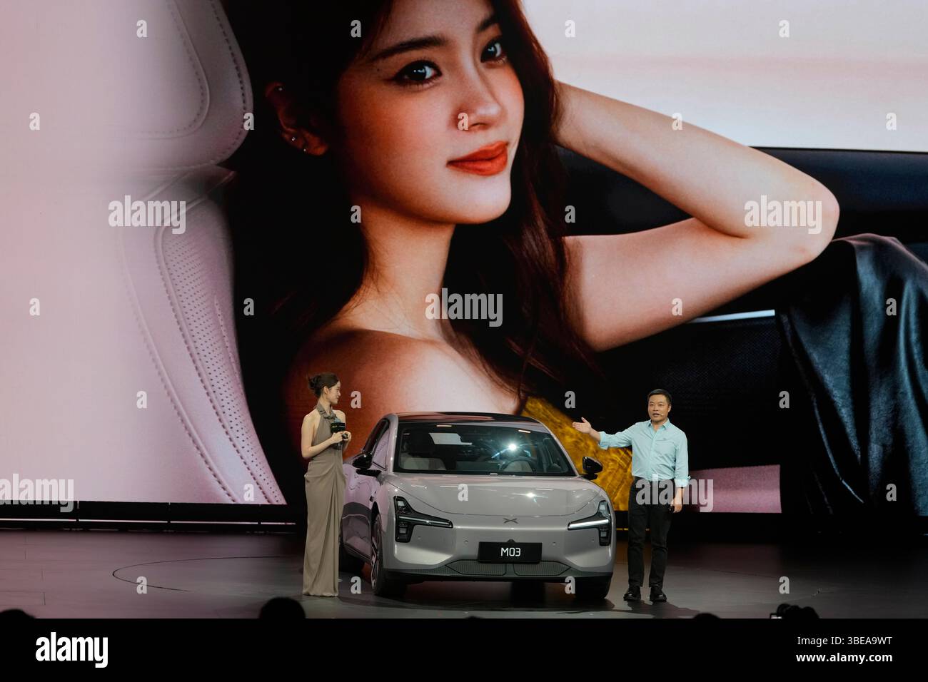 Xiaopeng He, Chairman and CEO of Chinese automaker XPENG, right and brand ambassador Ouyang Nana ...