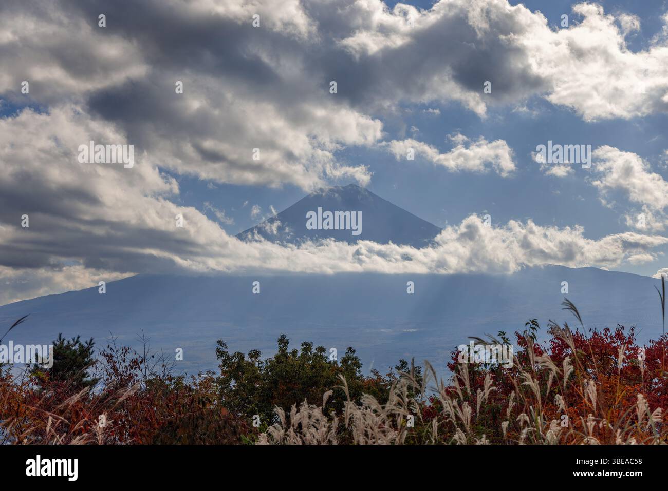 Mount Fuji partially hidden by clouds viewed from Komitake Shrine in ...