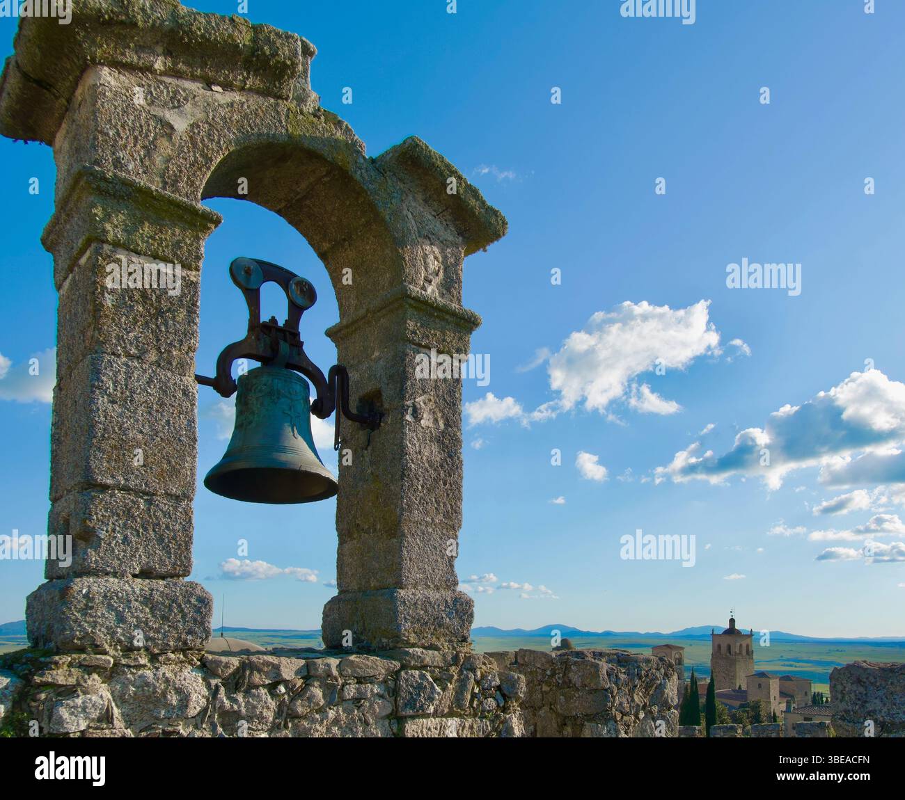 Landscape view from the Alcazaba de Trujillo with a bell in an arch and ...