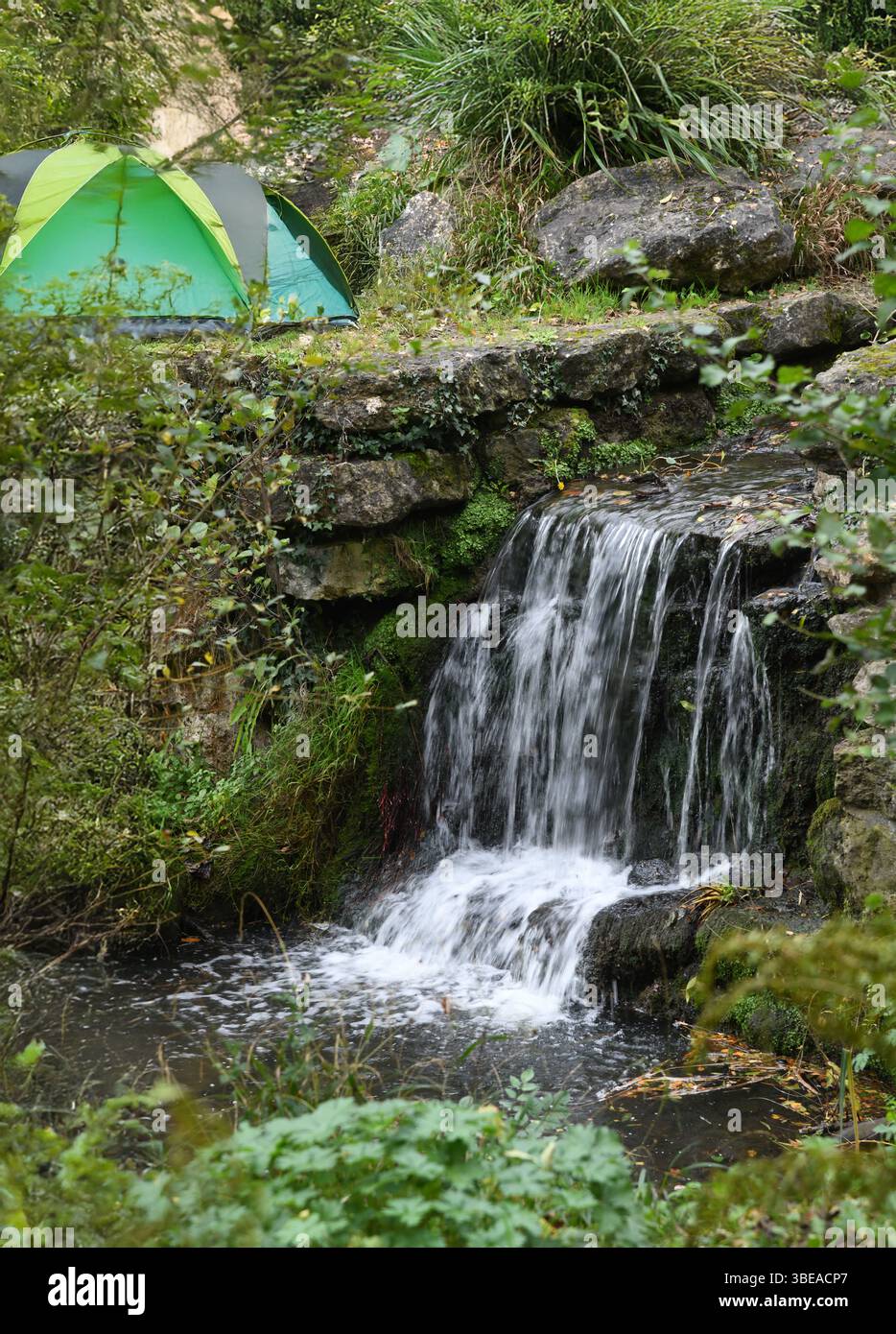 Camping by a river Stock Photo - Alamy