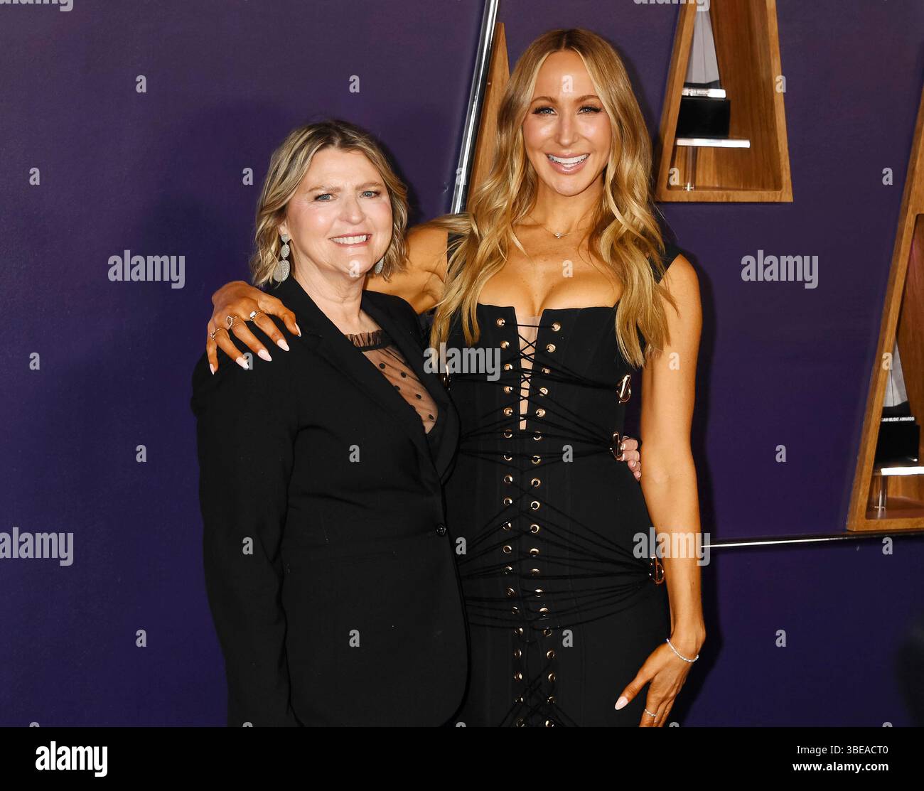 Julie Glaser and Nikki Glaser arrive at the 2025 American Music Awards ...