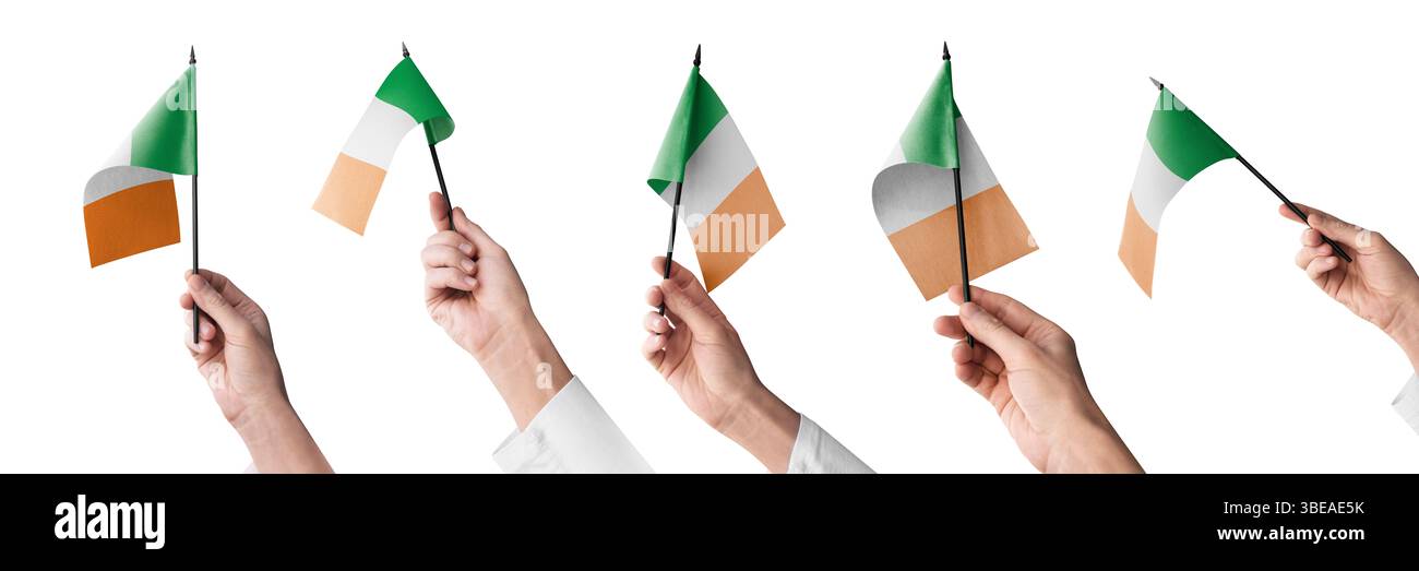 The Ireland flag in hand in different angles on a white background ...