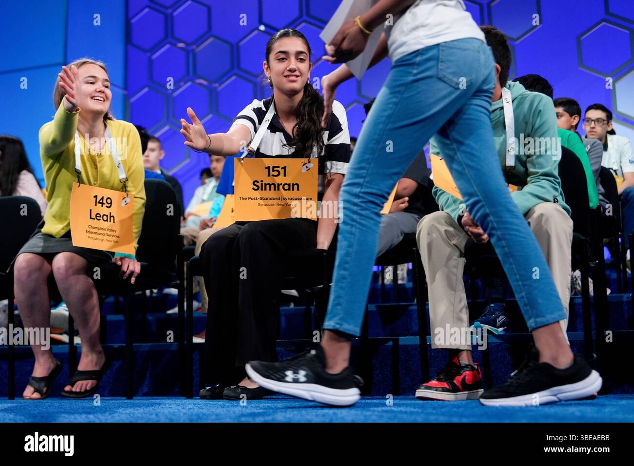 Simran Sanders, 14, of Syracuse, N.Y., high fives Aishwarya Kallakuri ...