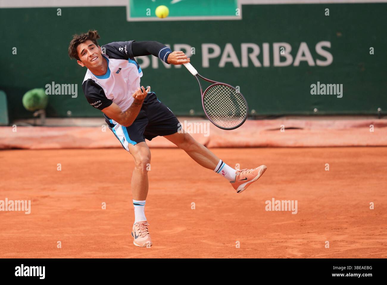 Italy's Matteo Gigante returns the ball to Greece's Stefanos Tsitsipas ...