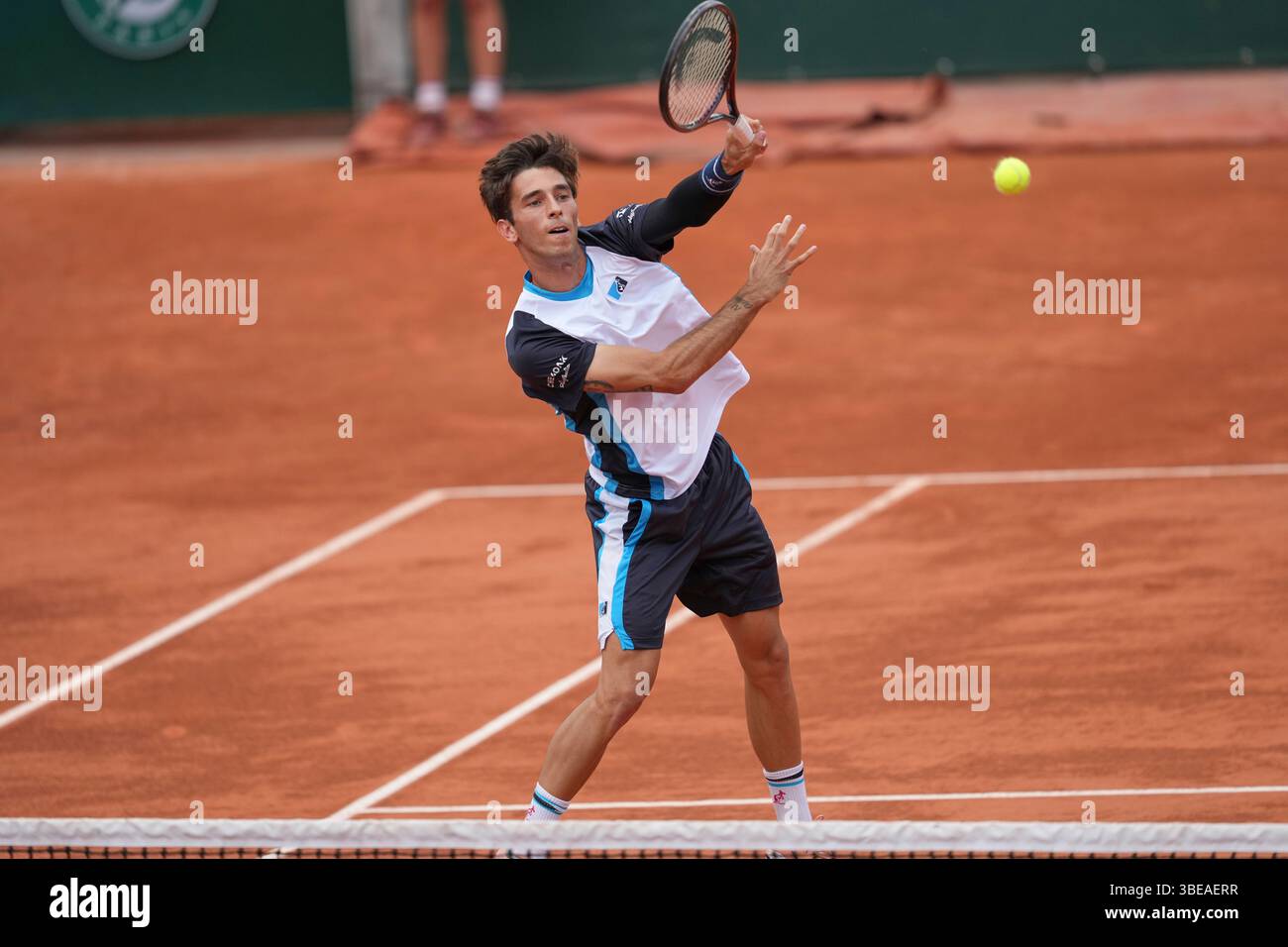 Italy's Matteo Gigante returns the ball to Greece's Stefanos Tsitsipas ...