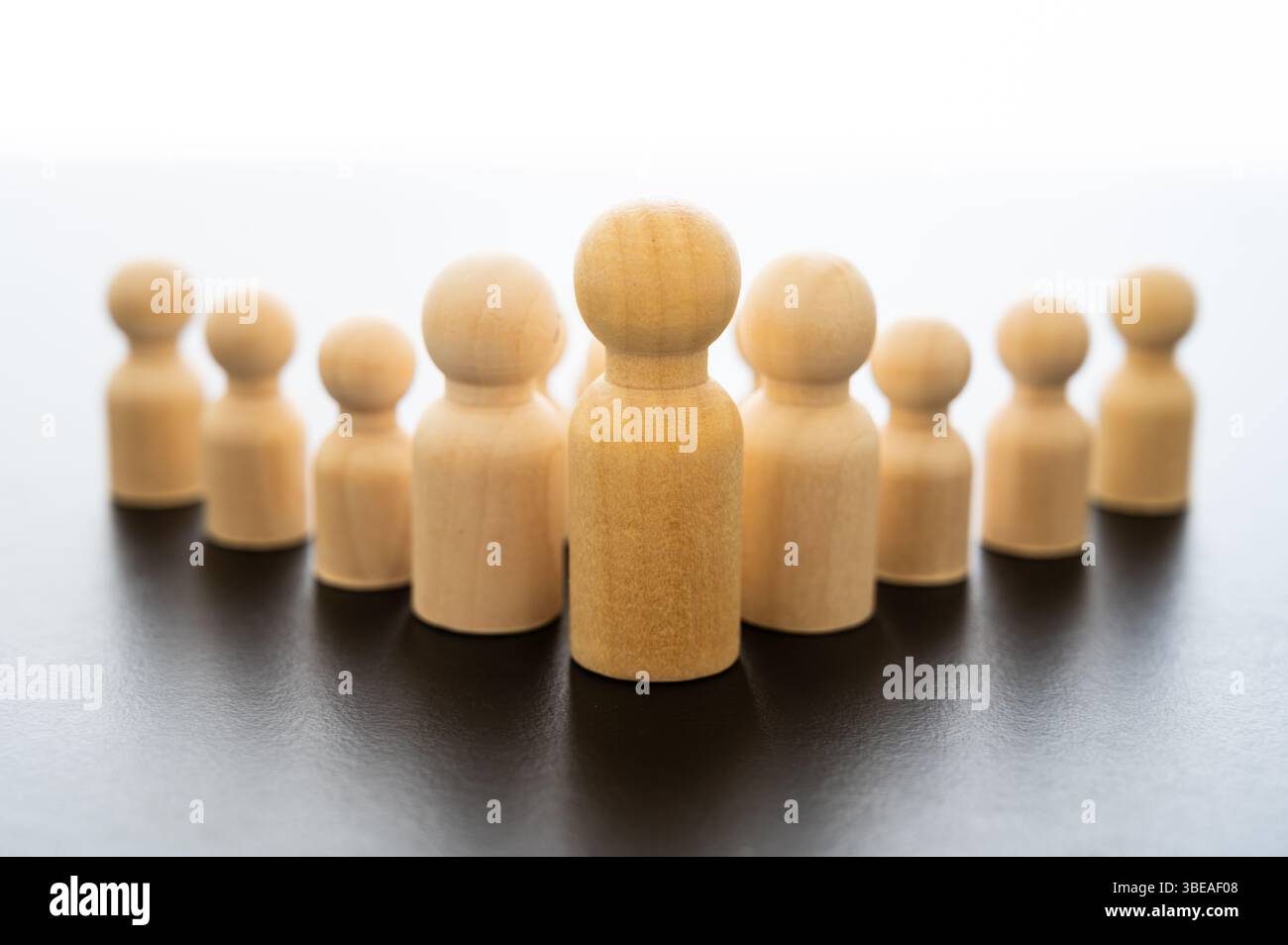 Conceptual representation, with wooden pawns, of a man alone in command ...
