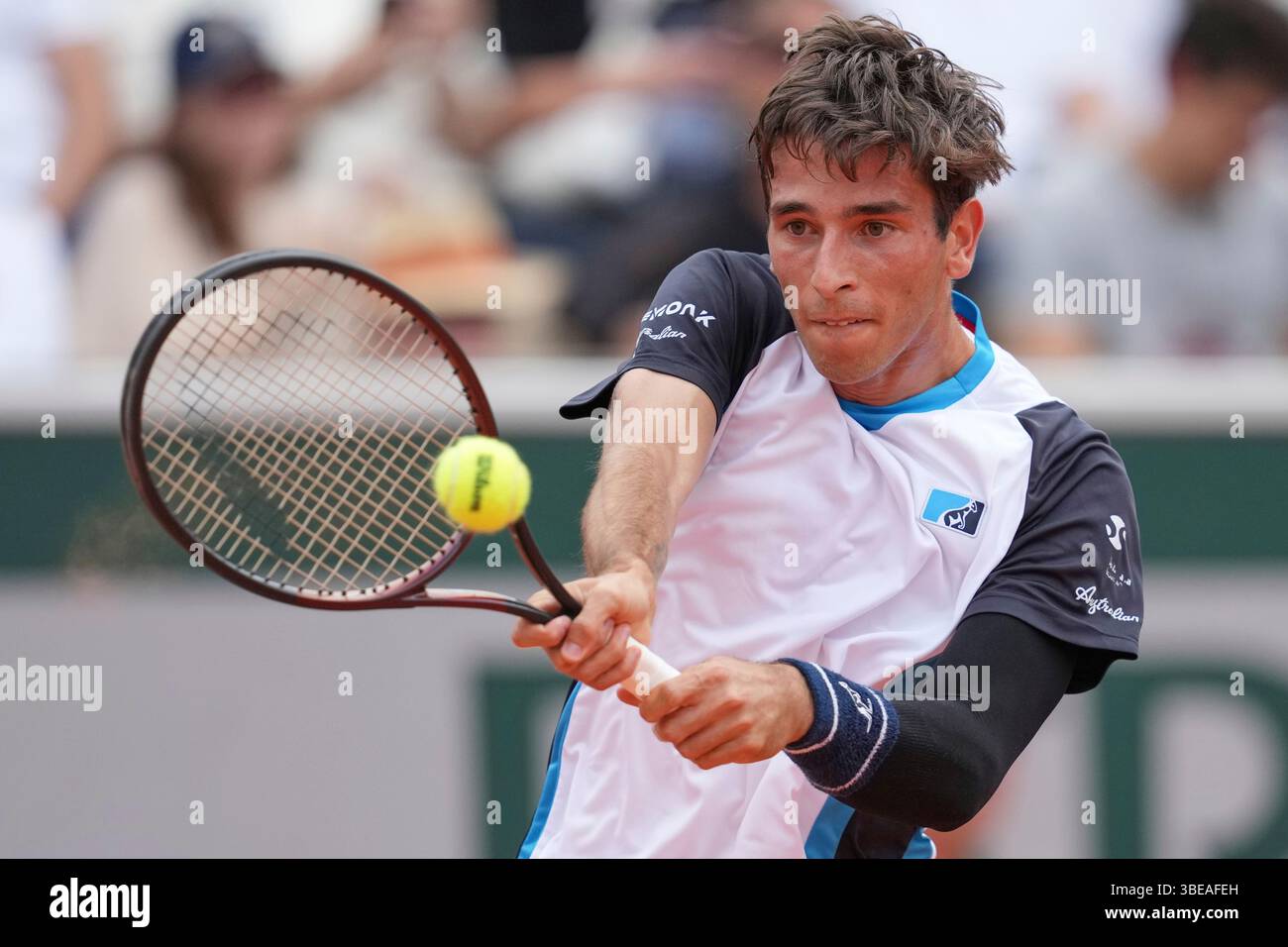 Italy's Matteo Gigante returns the ball to Greece's Stefanos Tsitsipas ...