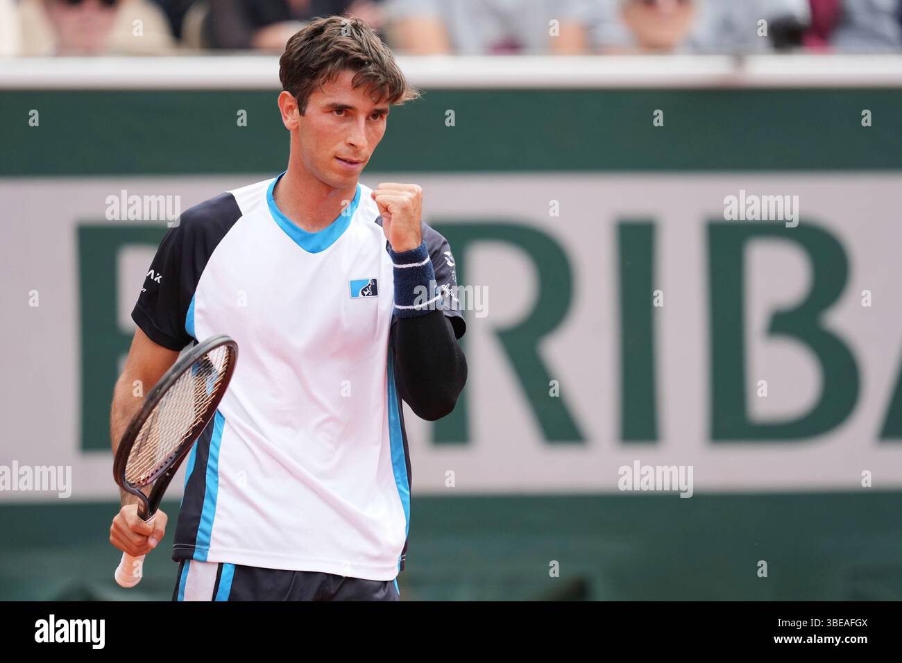 Italy's Matteo Gigante reacts winning a point to Greece's Stefanos ...