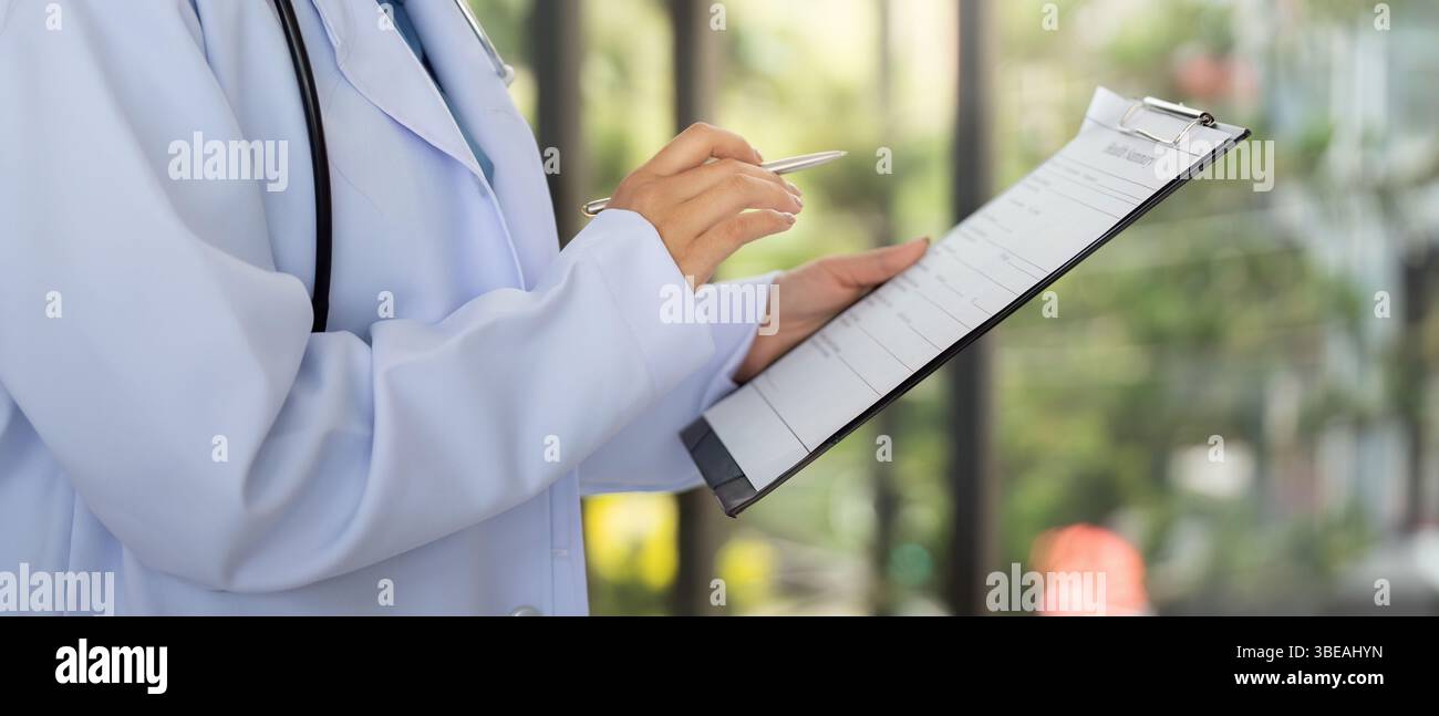 Healthcare Professional Reviewing Patient Chart and Medications Stock ...
