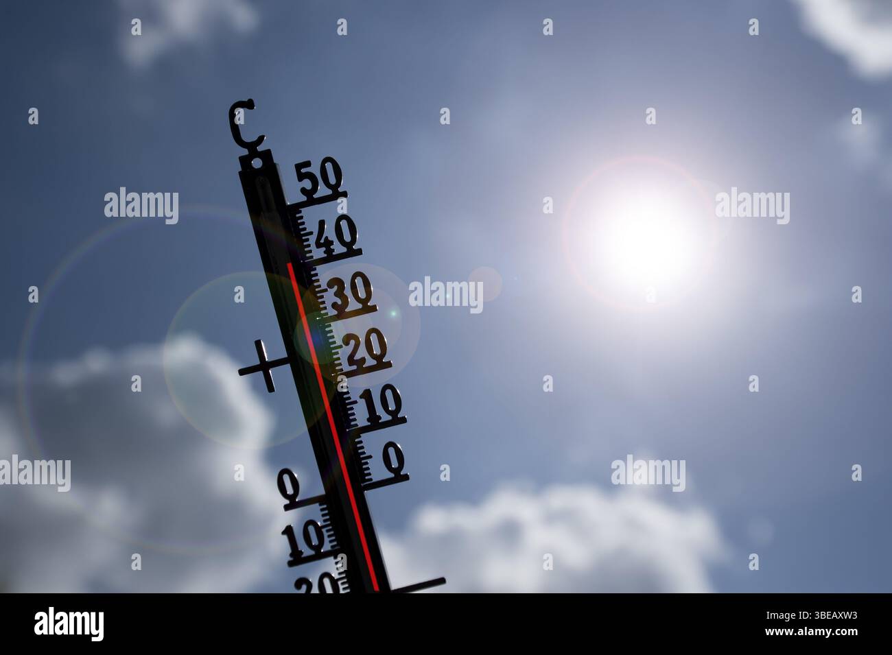 Symbolic image heat wave, thermometer in the sun, summer, climate ...