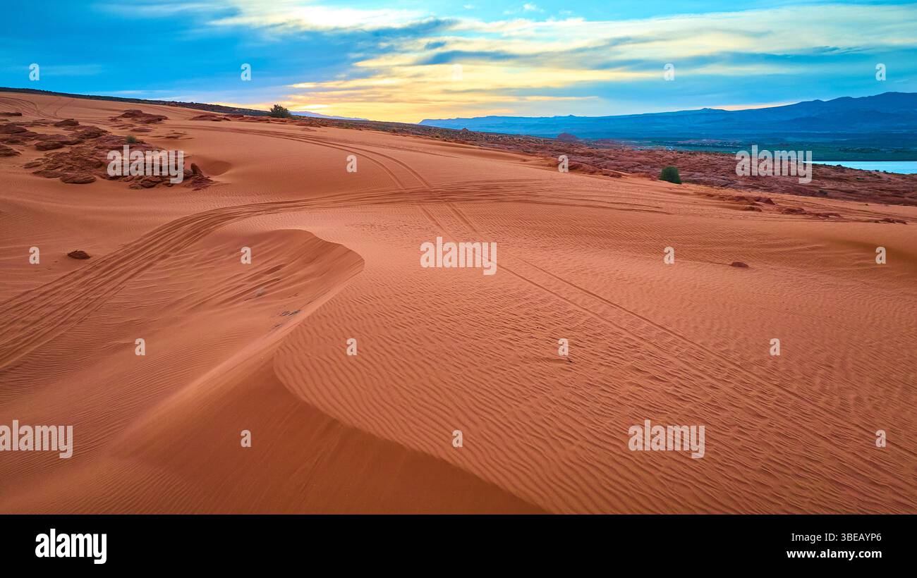 Aerial Sand Dunes and Red Rocks with Tire Tracks at Sand Hollow State ...