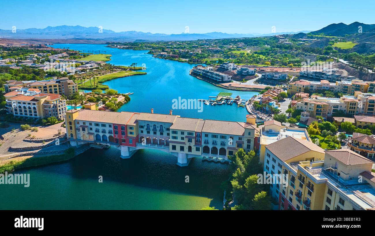 Aerial Vibrant Mediterranean Village Bridge and Waterfront Resort Lake ...