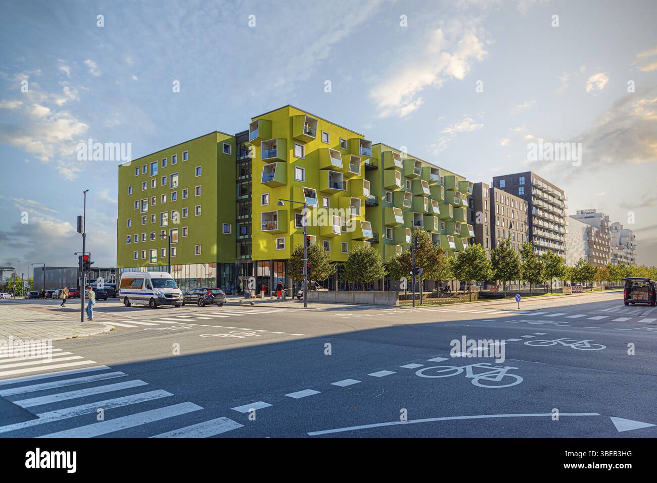 A modern residential building Orestad plejecenter in bright light green ...