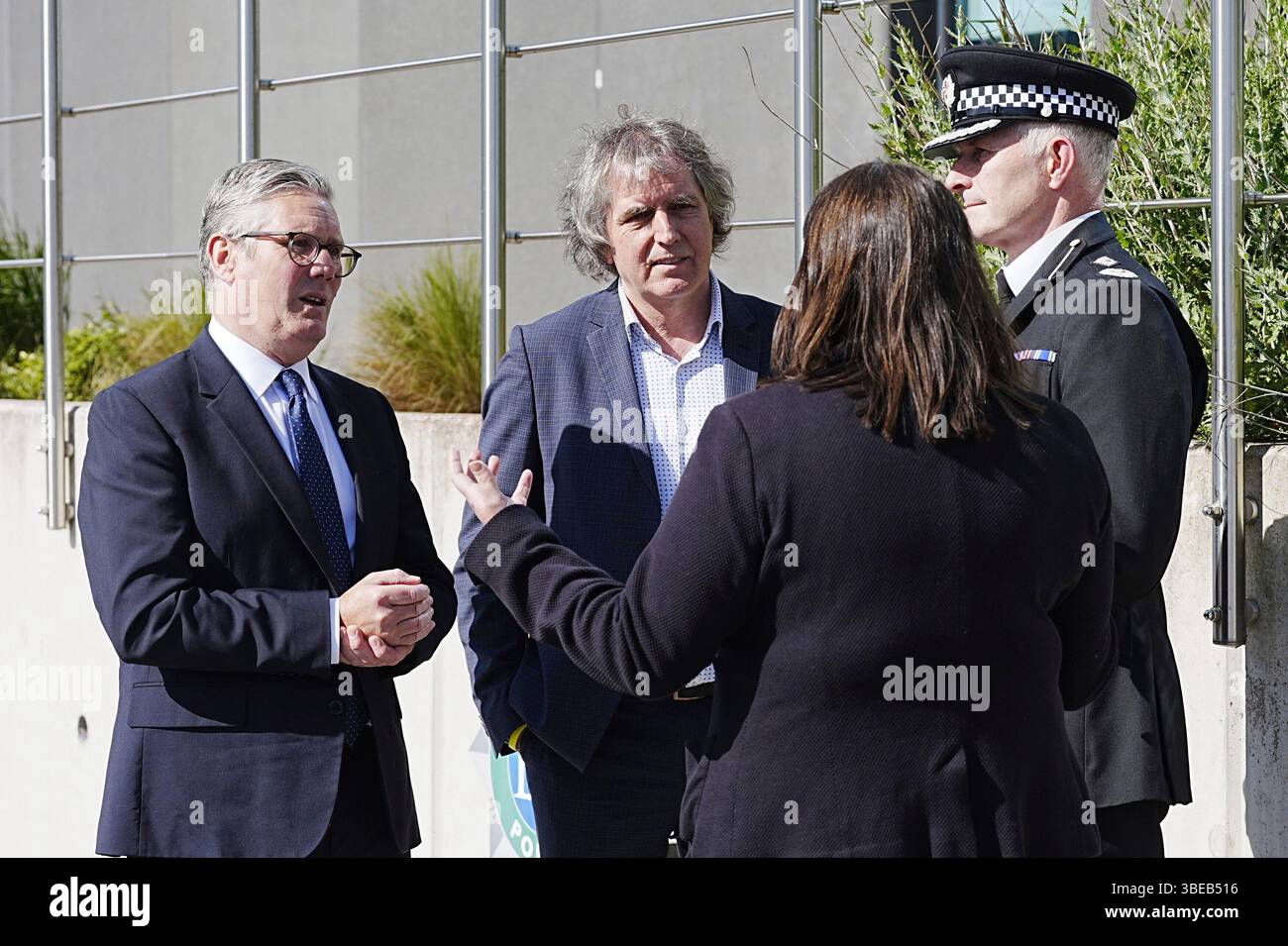 Britain's Prime Minister Keir Starmer, left, meets with Police and ...