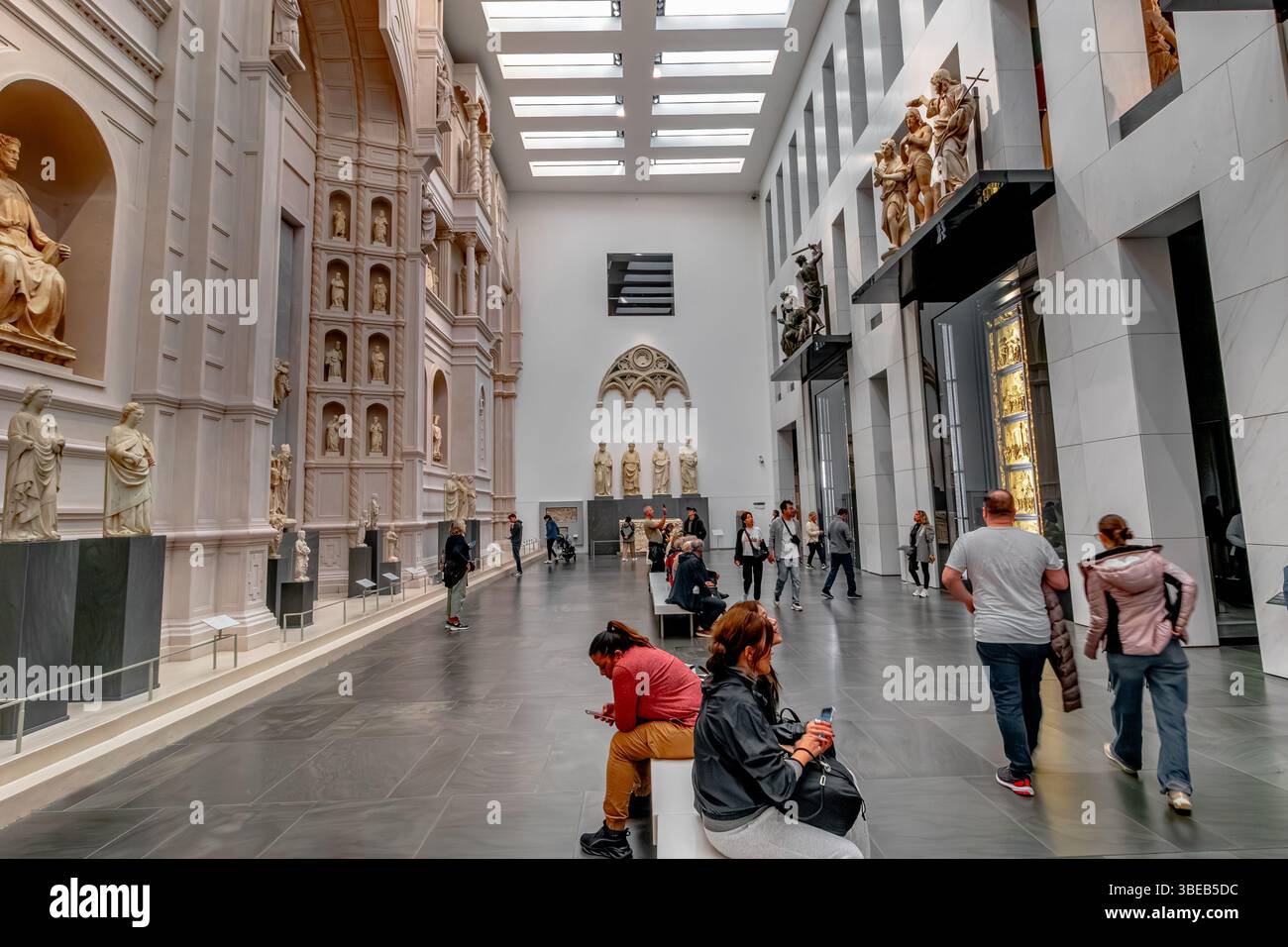 People admiring the sculptures on display in the Hall Of Paradise or ...