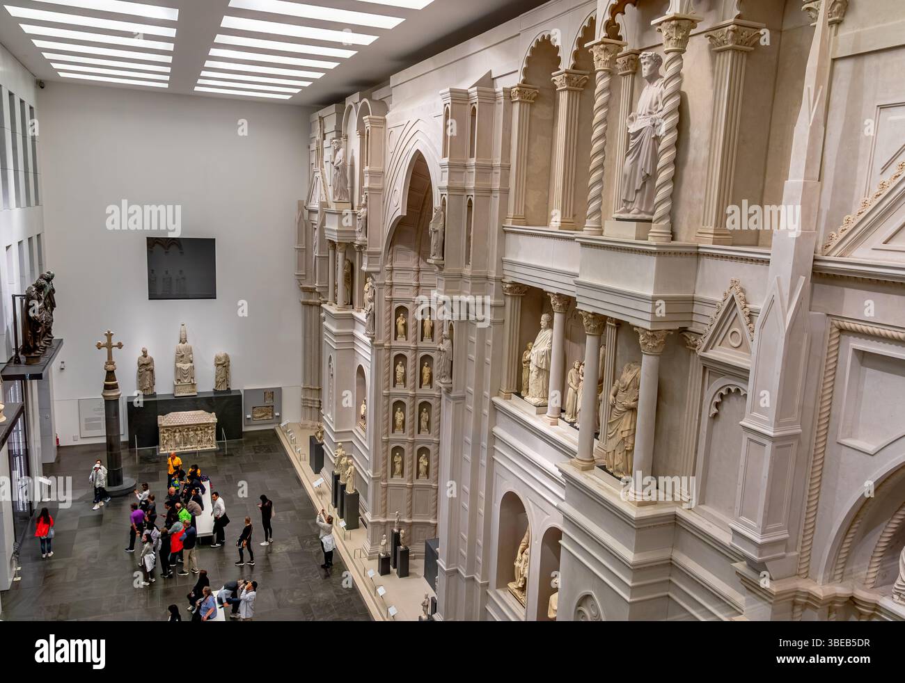 People admiring the sculptures on display in the Hall Of Paradise or ...