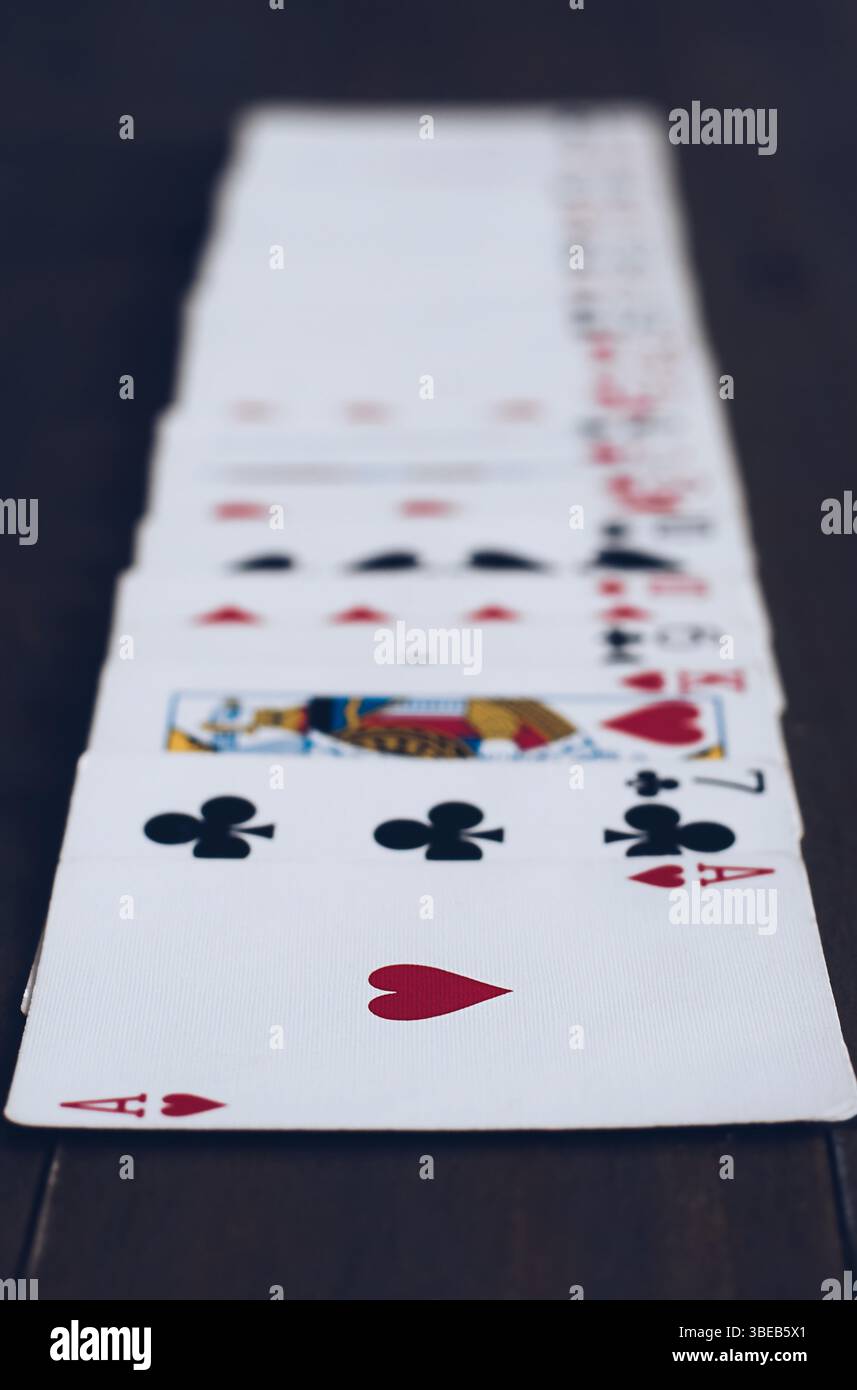 Deck of cards spread out on table Stock Photo - Alamy
