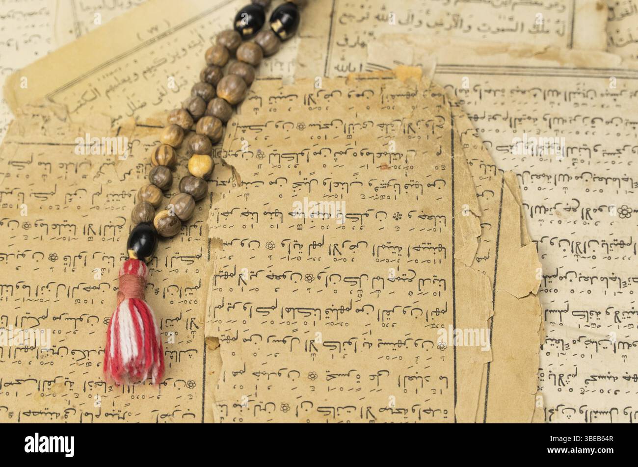 Muslim prayer beads with ancient pages from the Koran. Islamic and ...