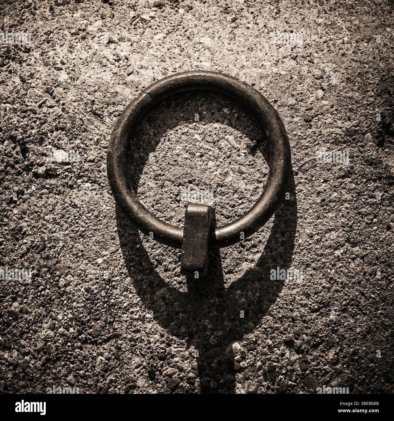 Mooring rings made of iron are embedded in the dockside, showcasing a ...