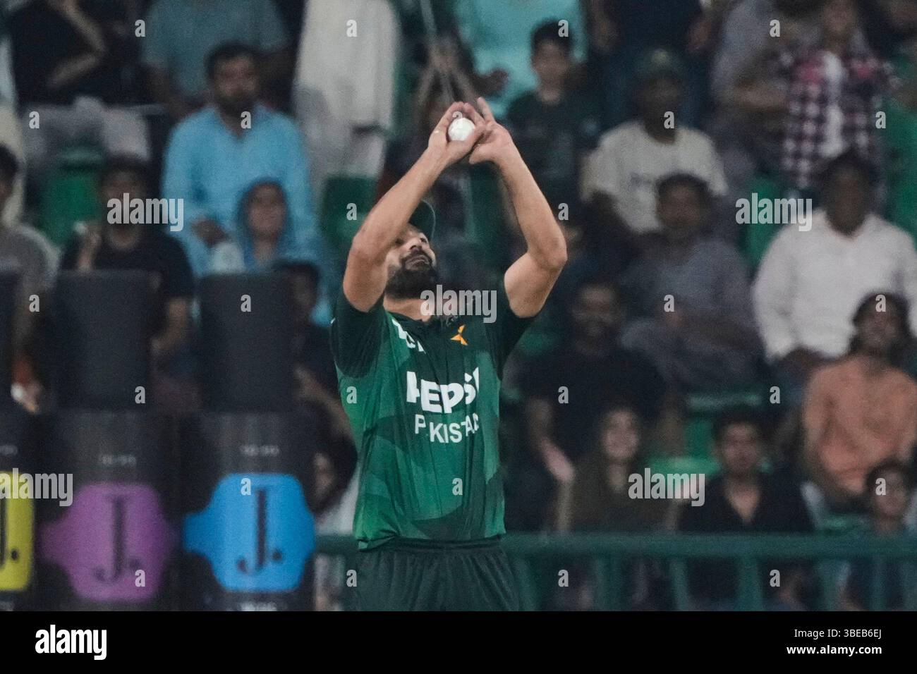 Pakistan's Haris Rauf takes the catch to dismiss Bangladesh's Parvez Hossain Emon during the ...