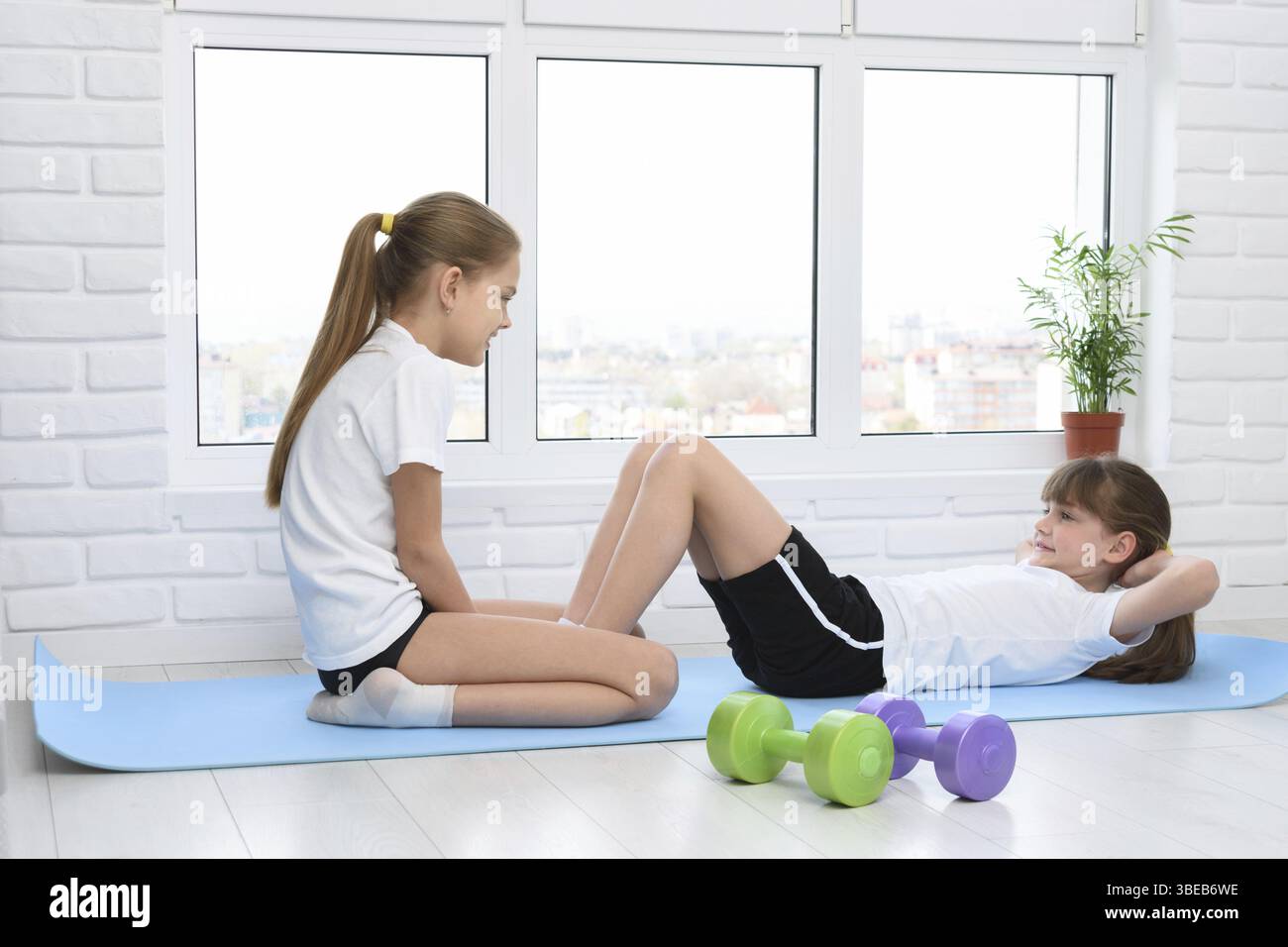 Sisters sports exercises home hi-res stock photography and images - Alamy