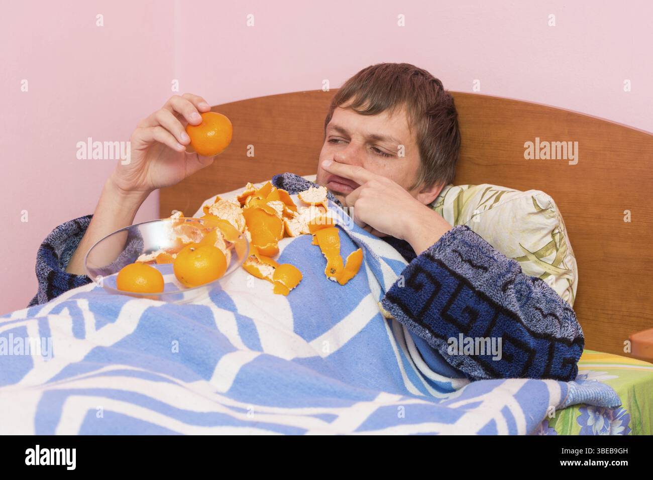Sick man lies in bed hi-res stock photography and images - Alamy