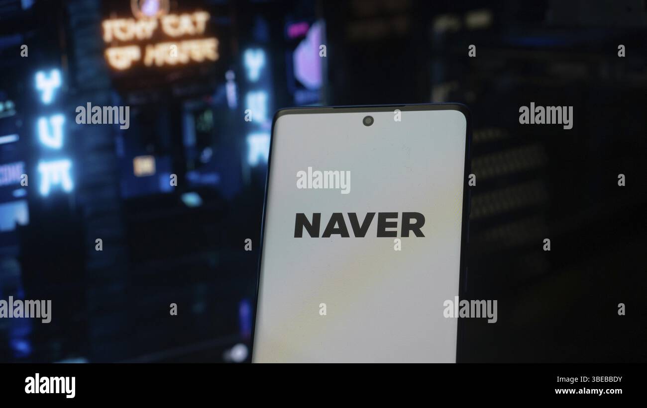 Naver logo on a smartphone screen set in front of an urban neon-lit ...