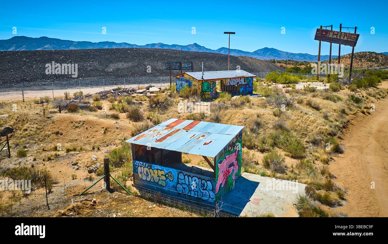 Aerial of Abandoned Graffiti Desert Buildings and NOTHING Signpost ...