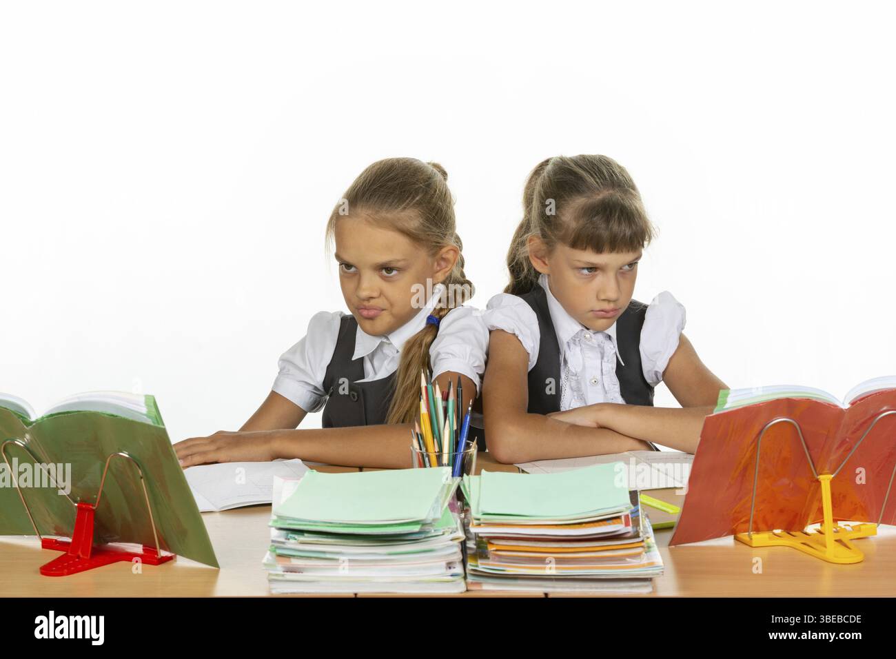 Two quarreling girls at the same desk Stock Photo - Alamy