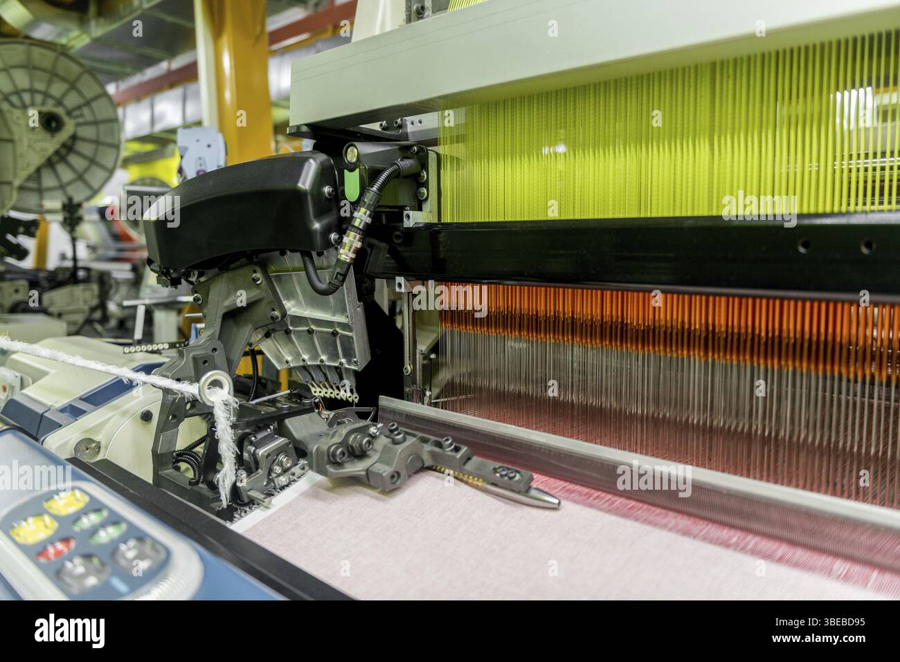 Weaving loom at a textile factory, closeup. industrial fabric ...
