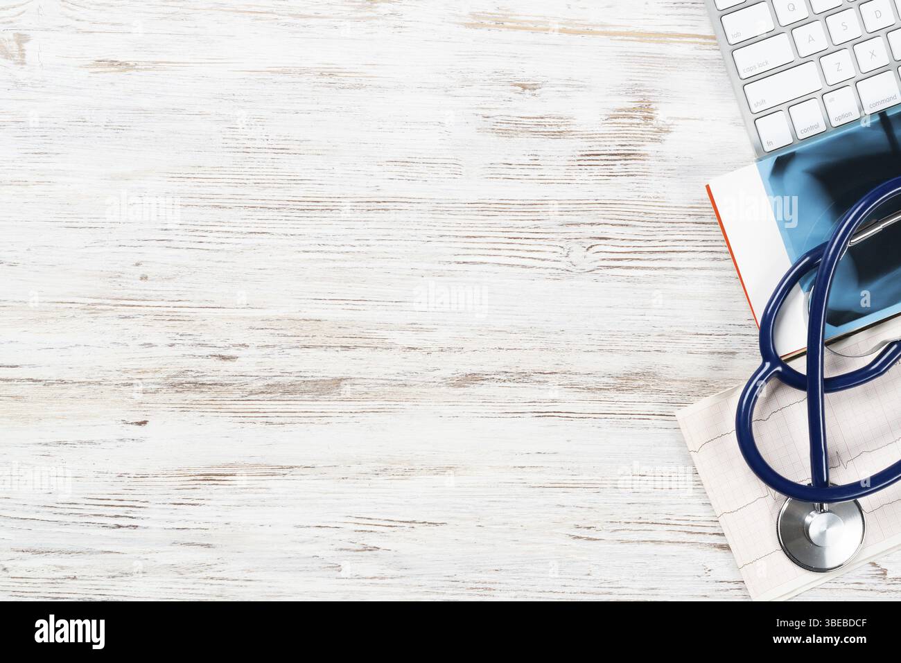 Doctors desktop with medical supplies. Computer keyboard, x-ray image ...