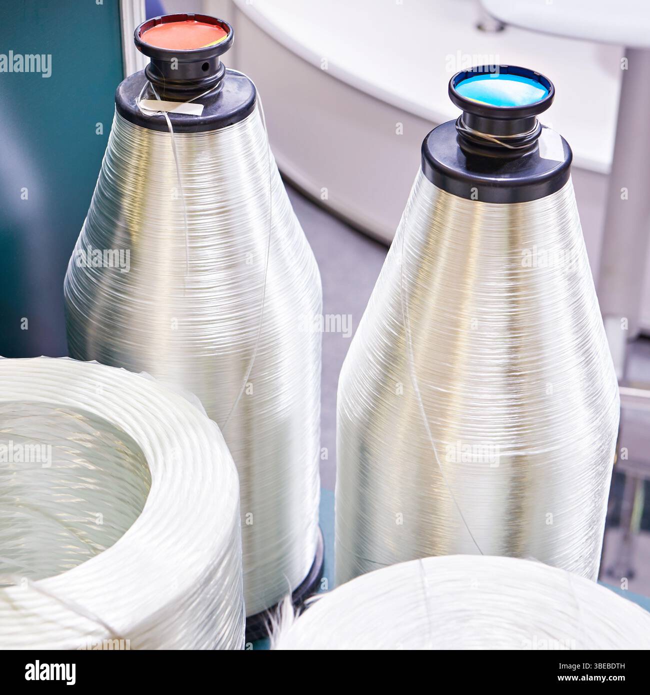 Fiberglass ropes in bobbins in store Stock Photo - Alamy