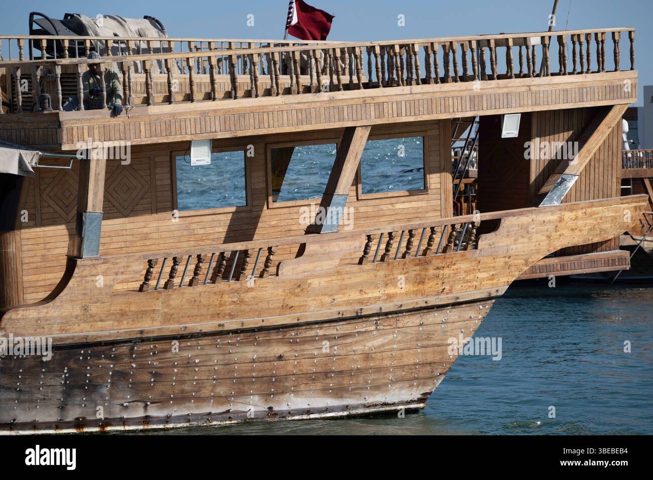 Traditional boats at the Dhow Harbor with doha skyline, Qatar Stock ...