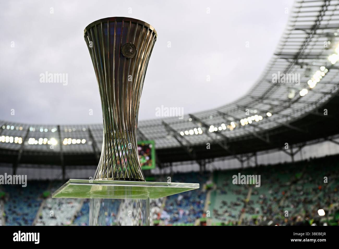The trophy is displayed on the pitch before the Europa Conference ...