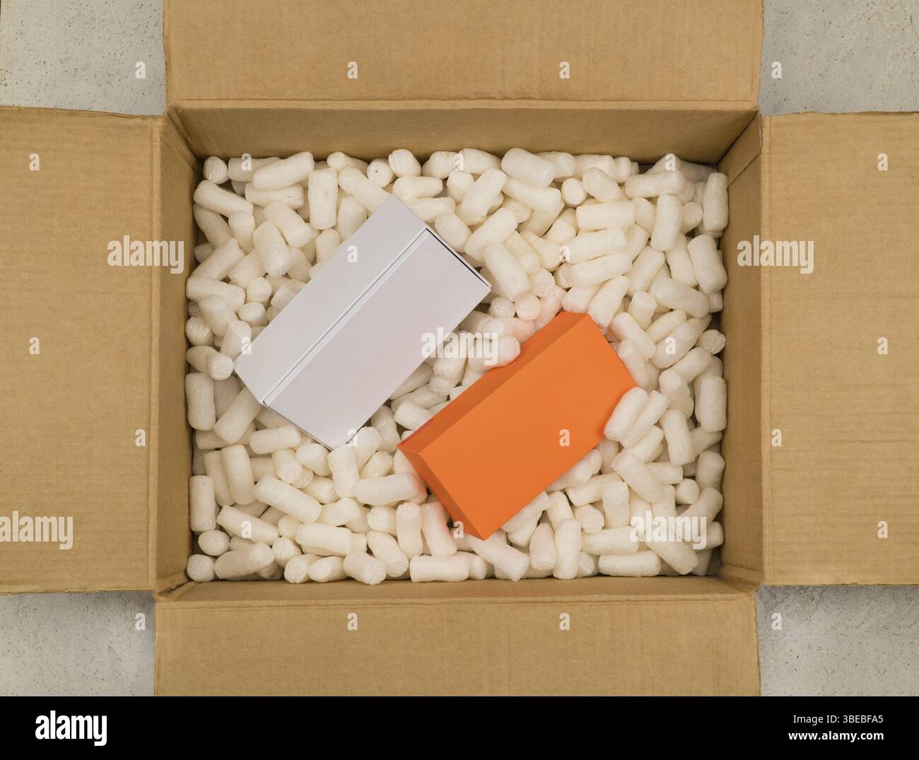 Cardboard box with styrofoam filler for safe packaging. Gift package ...