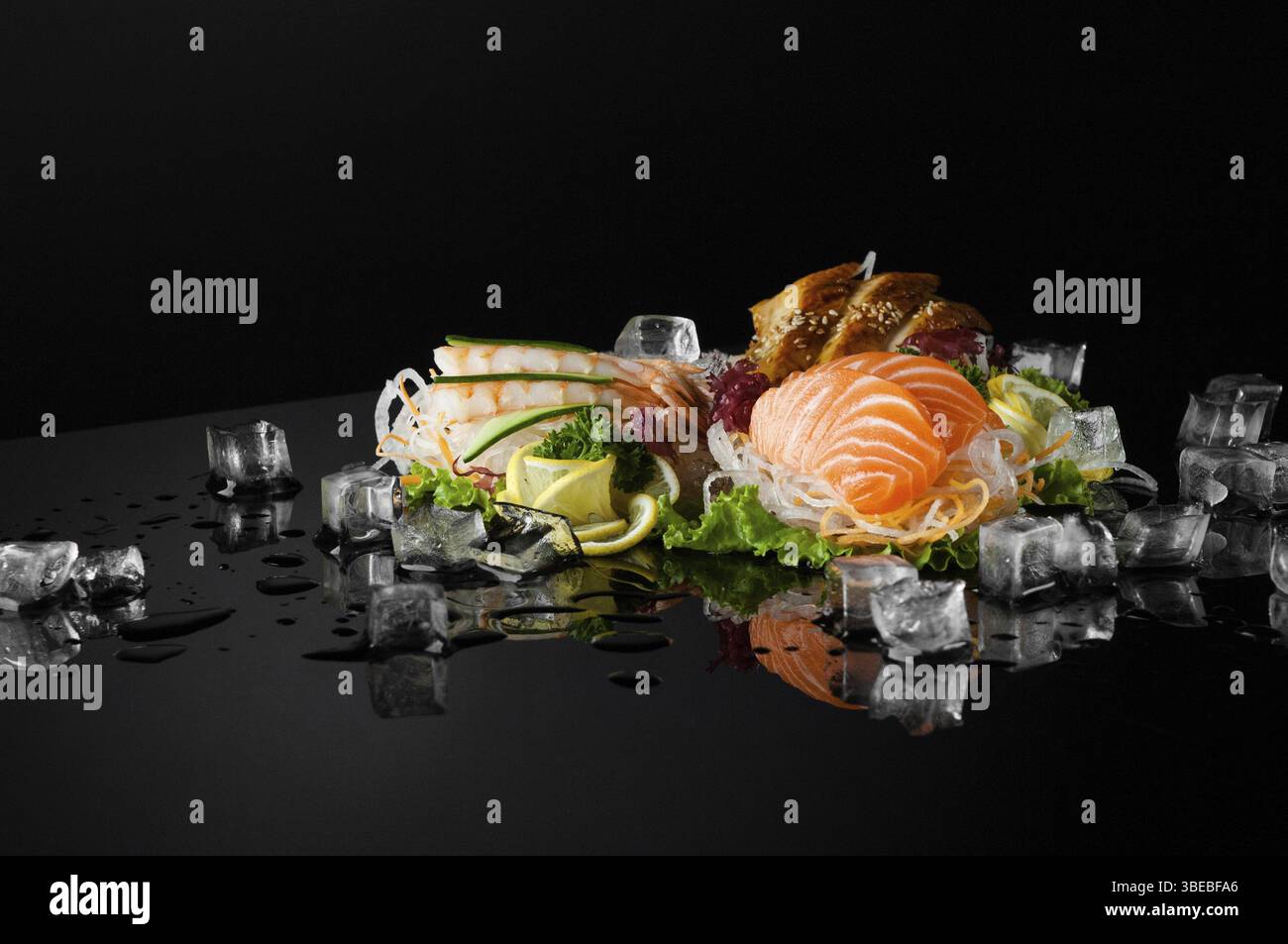 Set of sushi with pieces of melting ice on a black background with ...